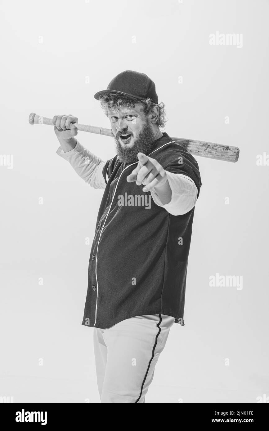 Challenge. Thrilled male baseball player wearing retro sports uniform ...