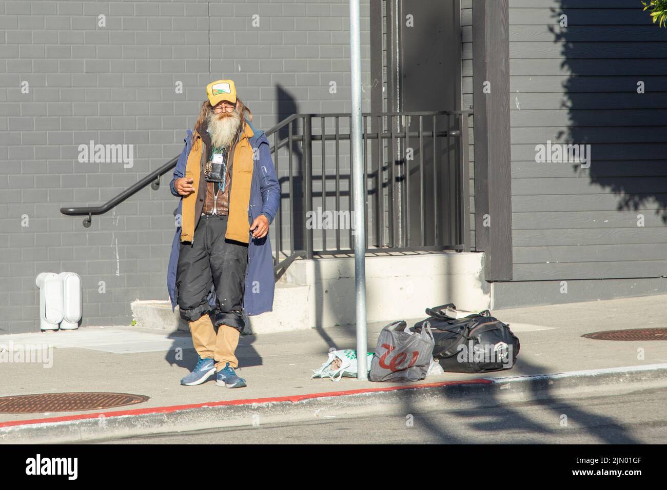 San Francisco, USA - May 20 2022: elderly homeless man with his ...