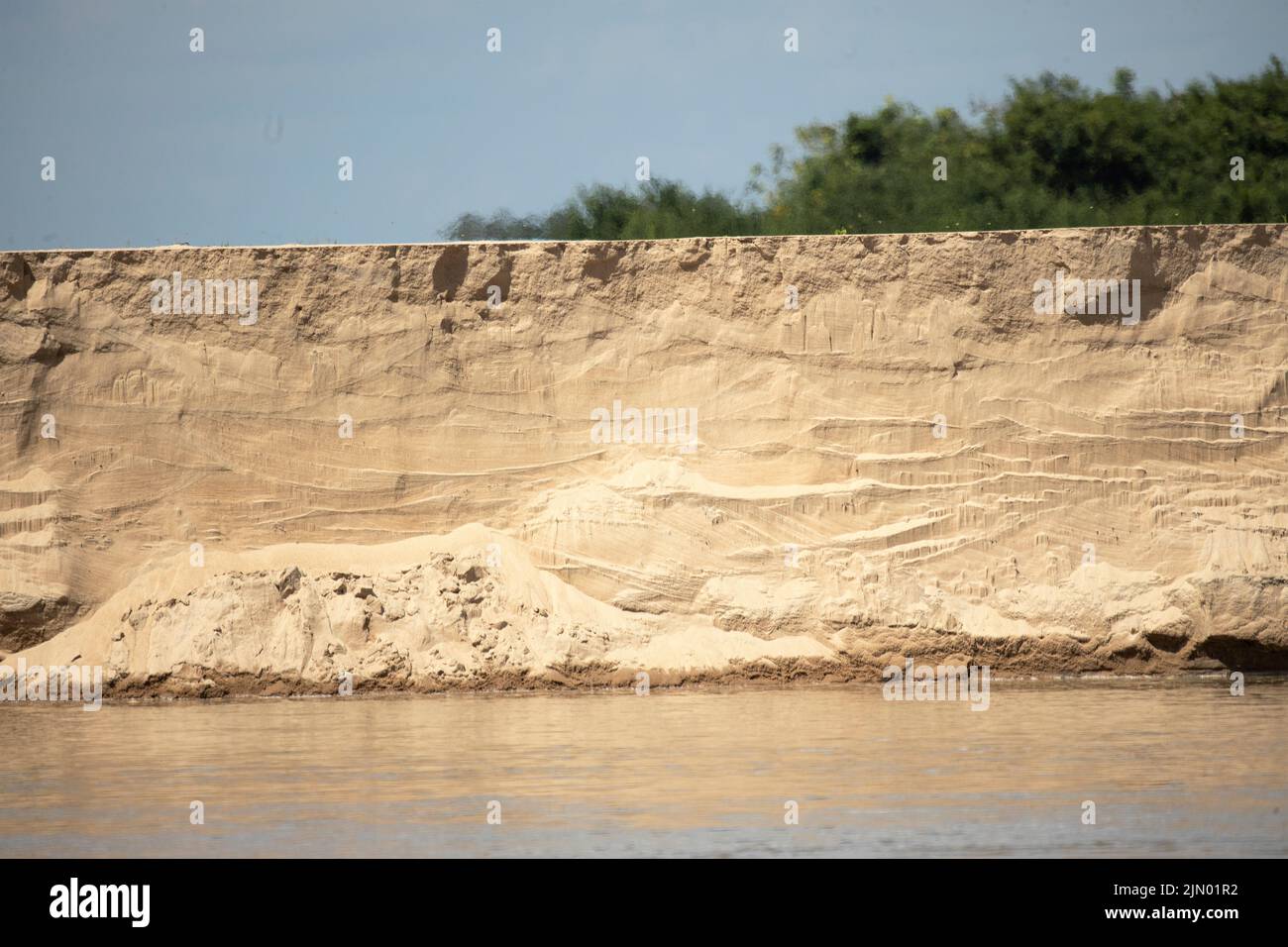 The eroded face of a sandbank in the Rufiji River shoes the different ...