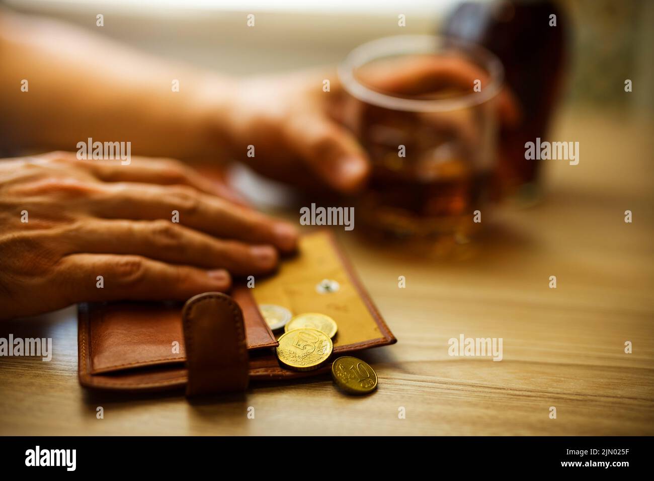 Fired man countsing his last money to drink expensive alcohol Stock ...