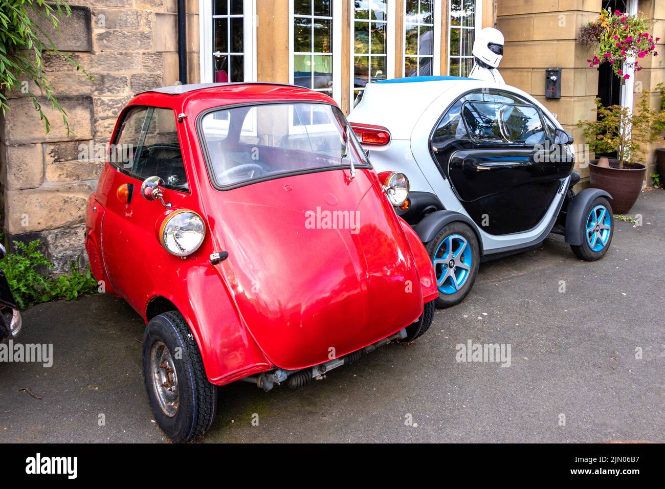renault twizy and classic red bubble car outside the Crown pub in the ...