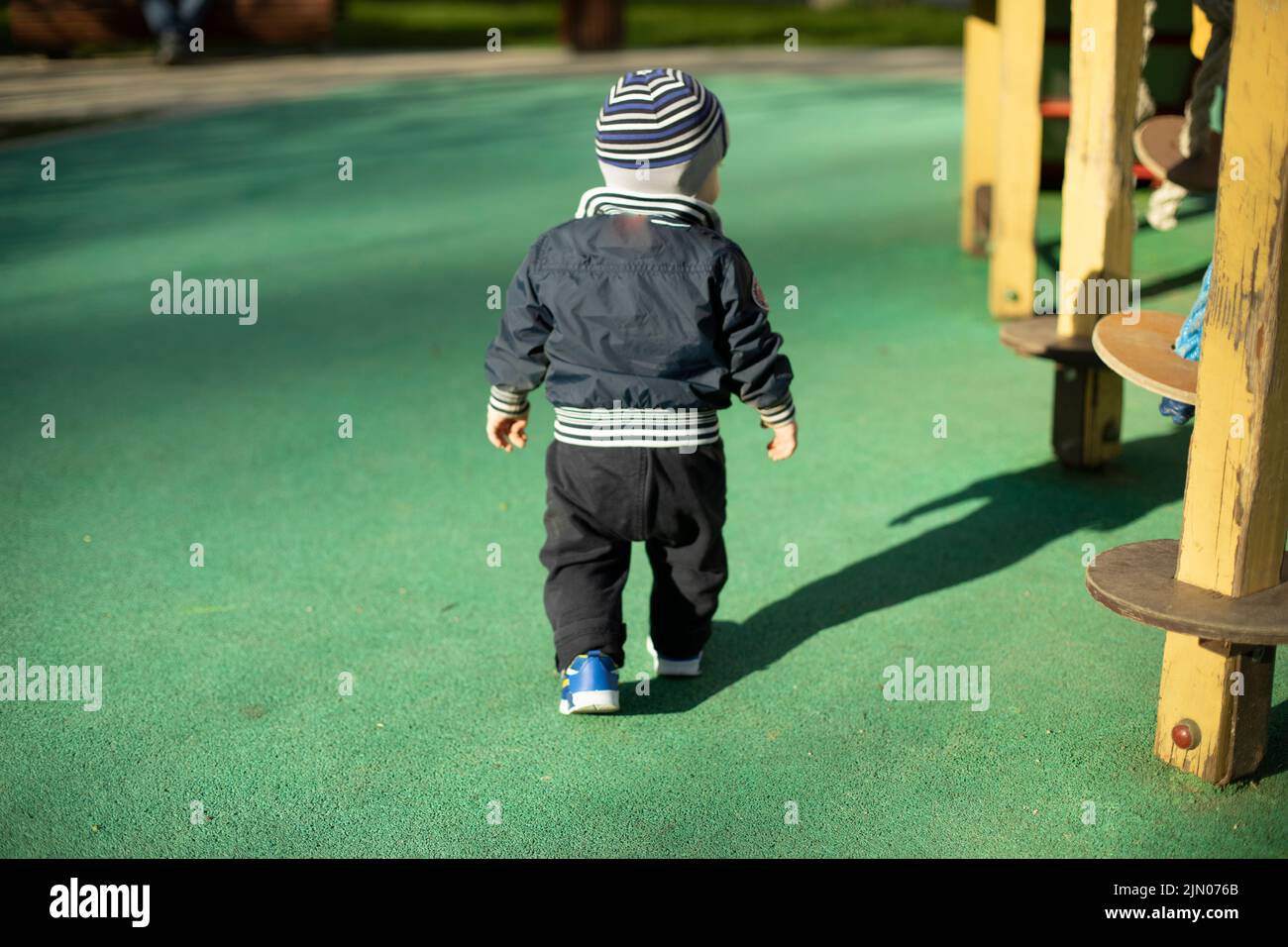 Child on playground. Small walks outside. Walk with child. Preschooler ...