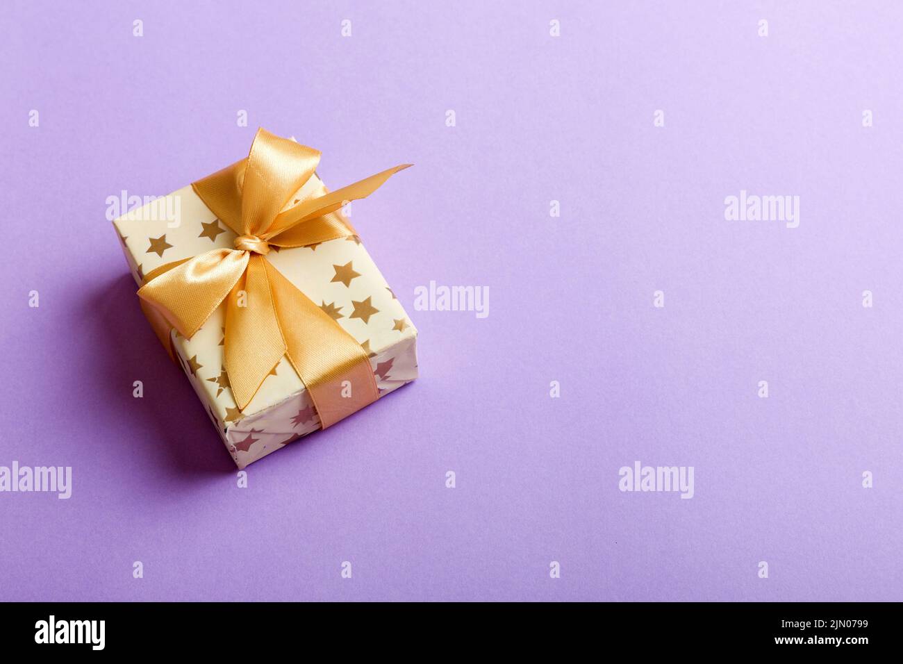 wrapped Christmas or other holiday handmade present in white paper with ...