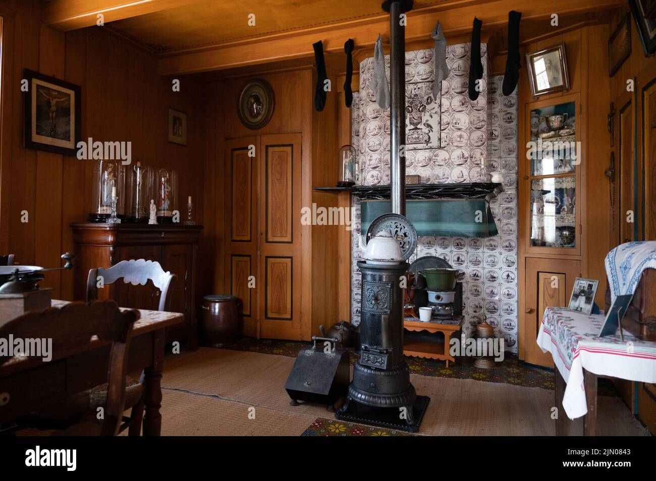 Old fashioned Dutch interior, wooden stove and room decoration in small ...