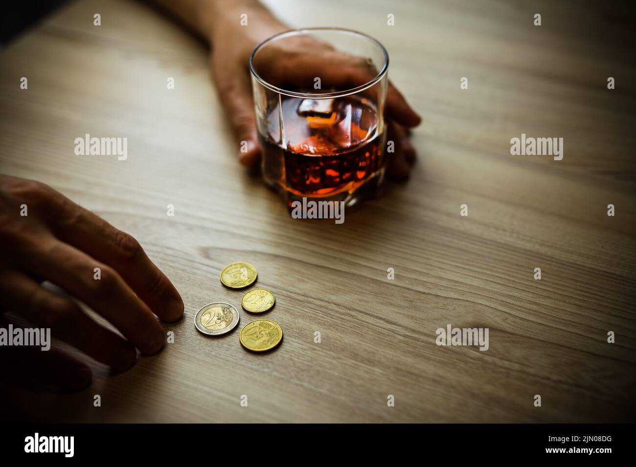 Fired man countsing his last money to drink expensive alcohol Stock ...
