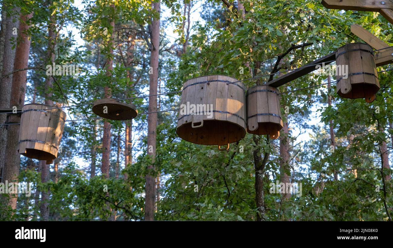 Rope adventure park in the summer forest. Abstract concept Overcoming ...