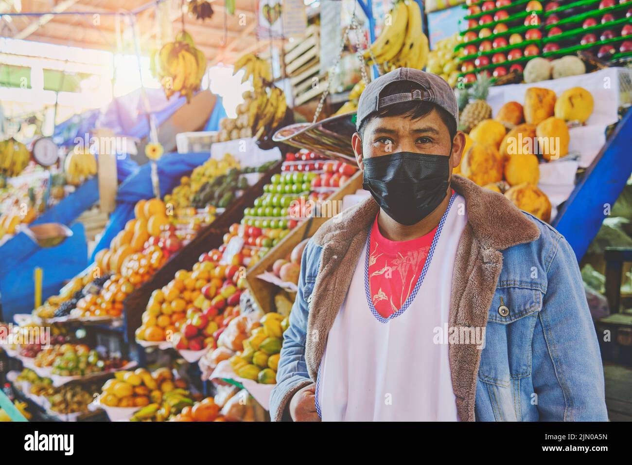 Portrait of a men working in street market - with face mask, Public ...