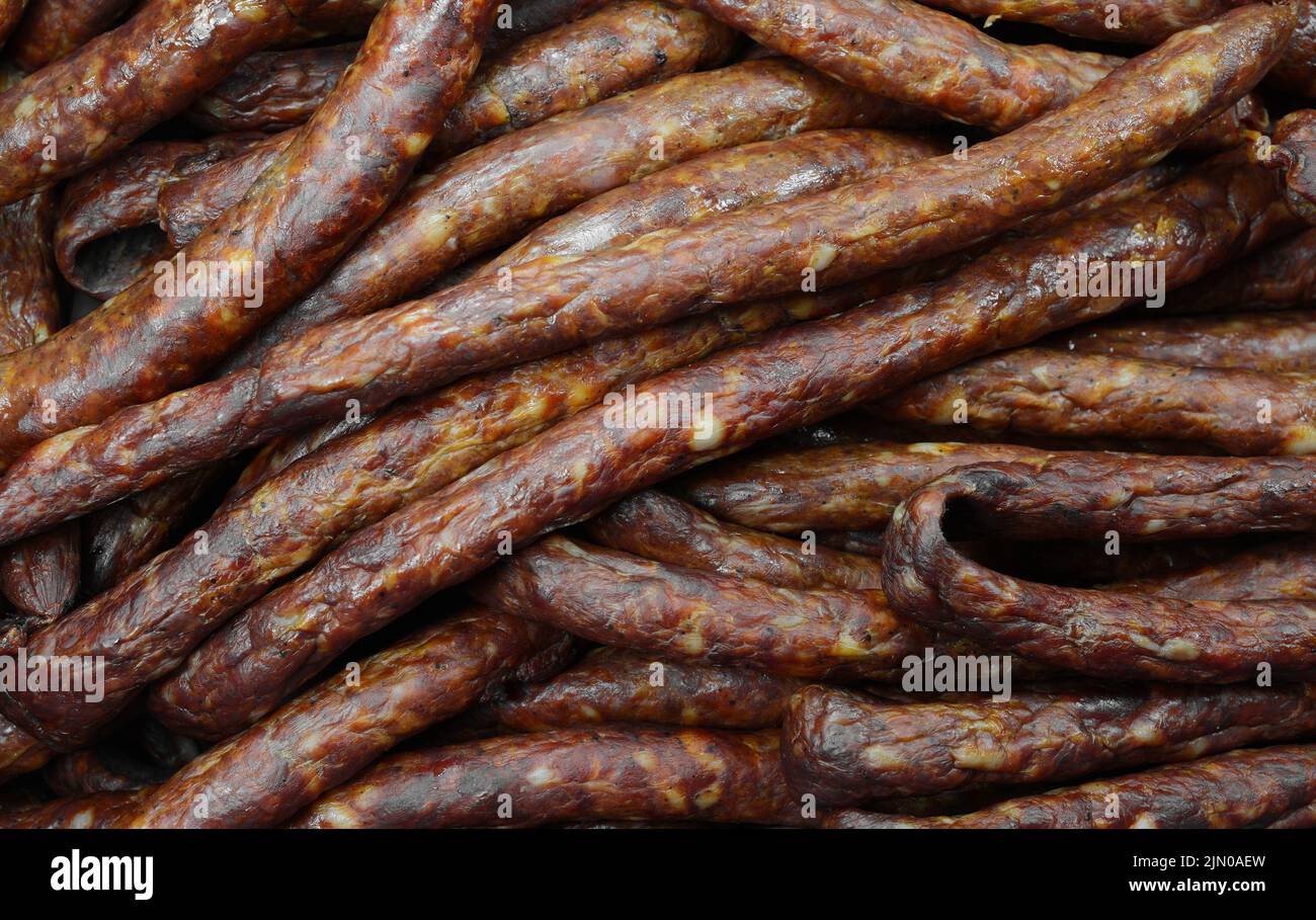 Closeup smoked sausages. Full frame. Background. a lot of sausages ...