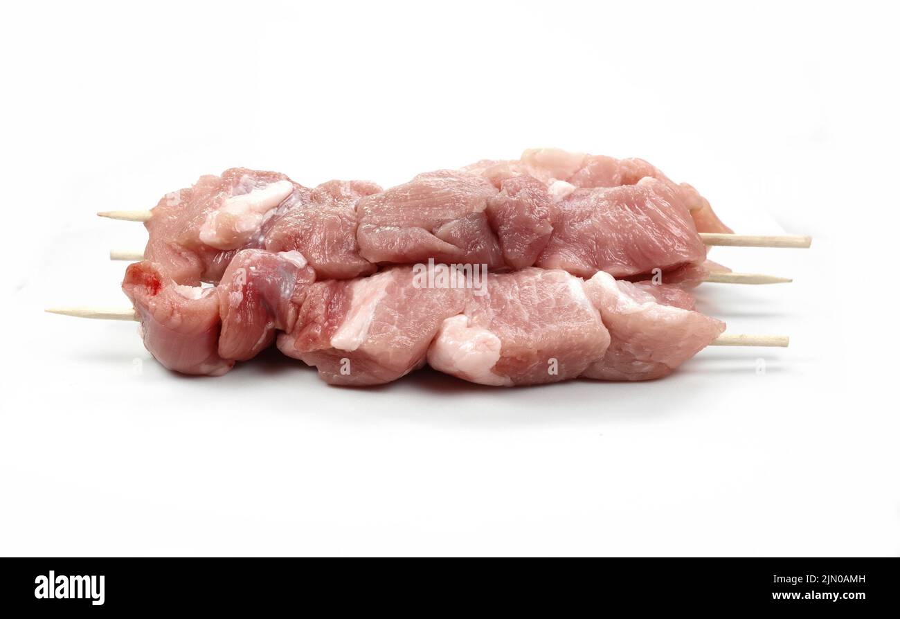 Raw pork kebab isolated on white Stock Photo - Alamy