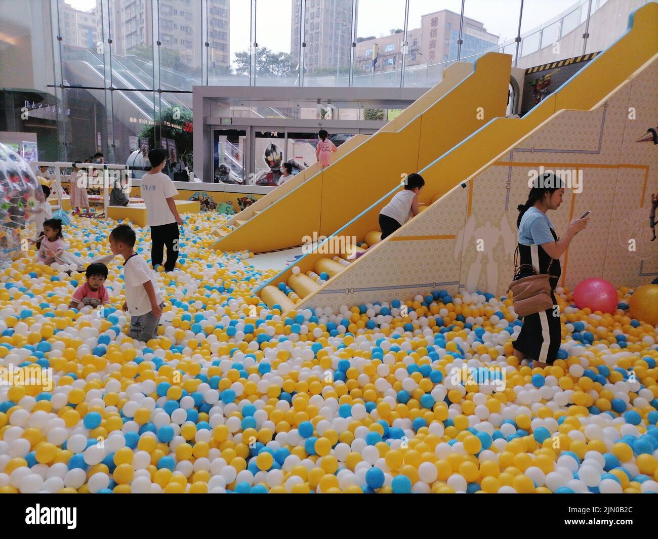 Parents take their children to play in children's playground in ...