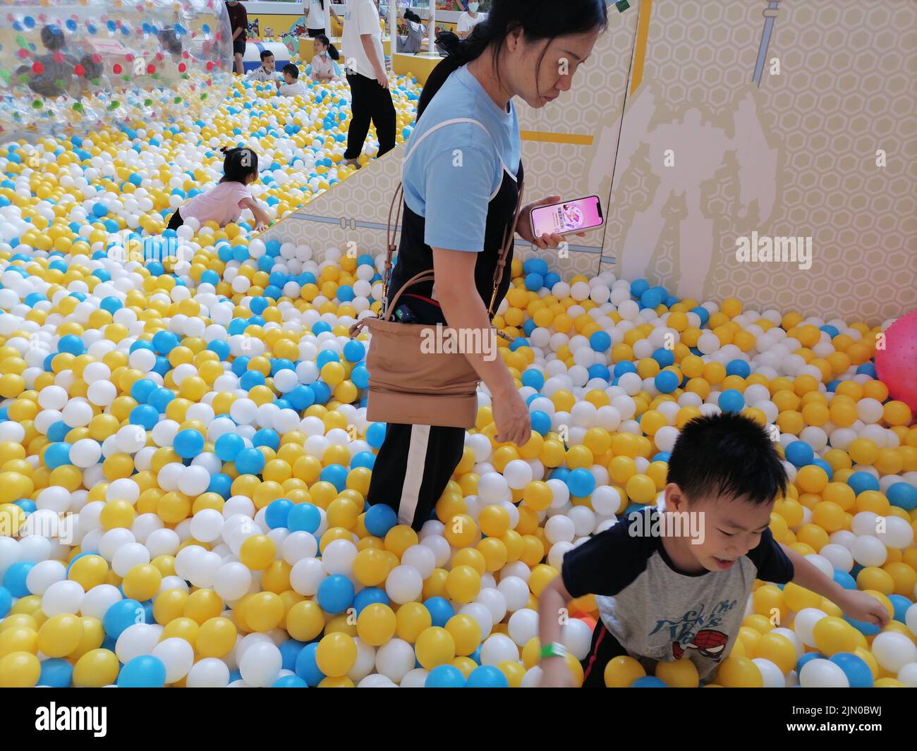 Parents take their children to play in children's playground in ...