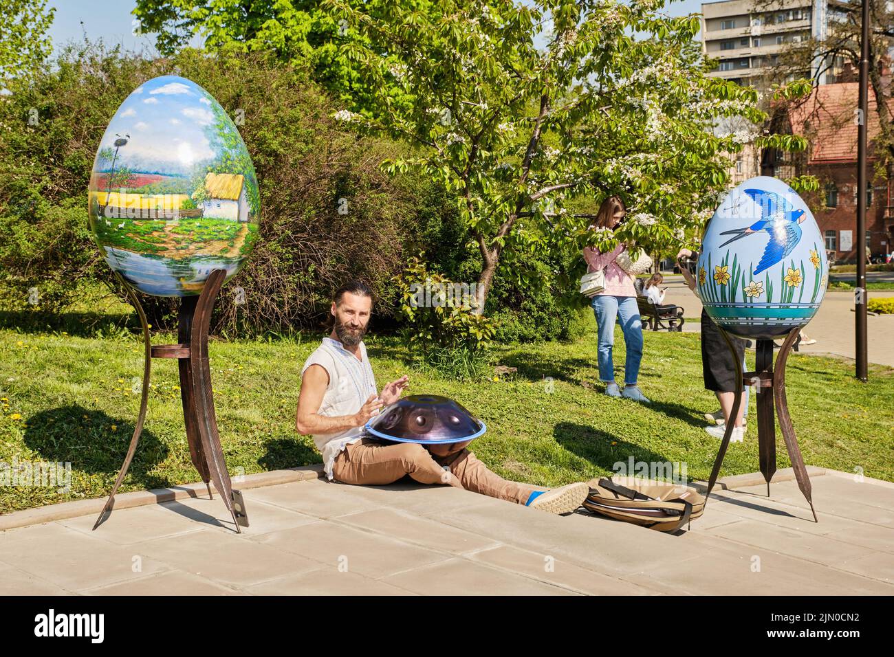 Street music performer playing some unique music with a handcrafted ...