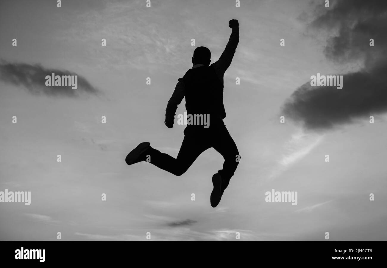 man jump high silhouette full of energy against sunset sky, energy ...
