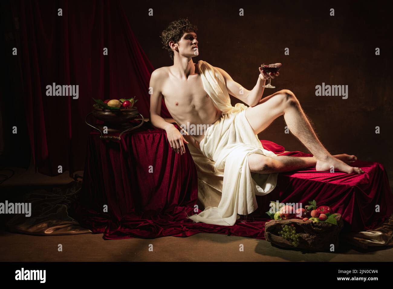 Artistic portrait of young handsome man in image of famous historical ...