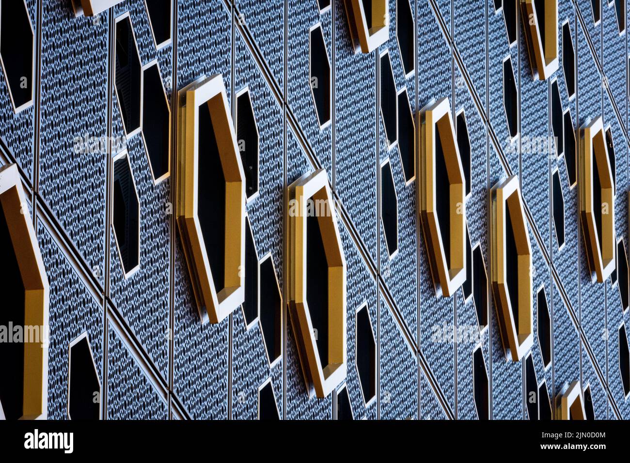 A low angle shot of a modern building design with hexagons in ...