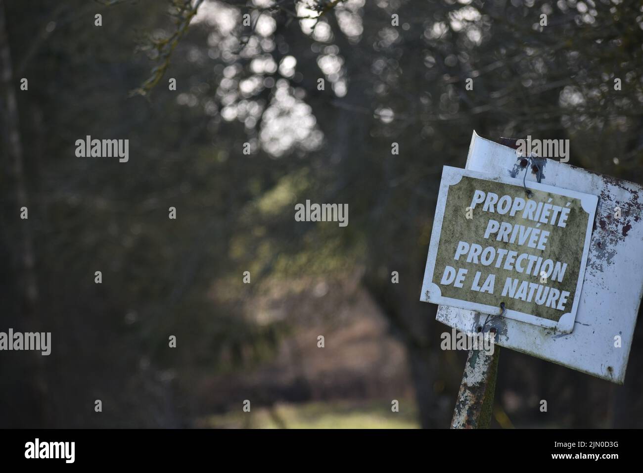 Outdoor sign with written on it in French « private property protection ...