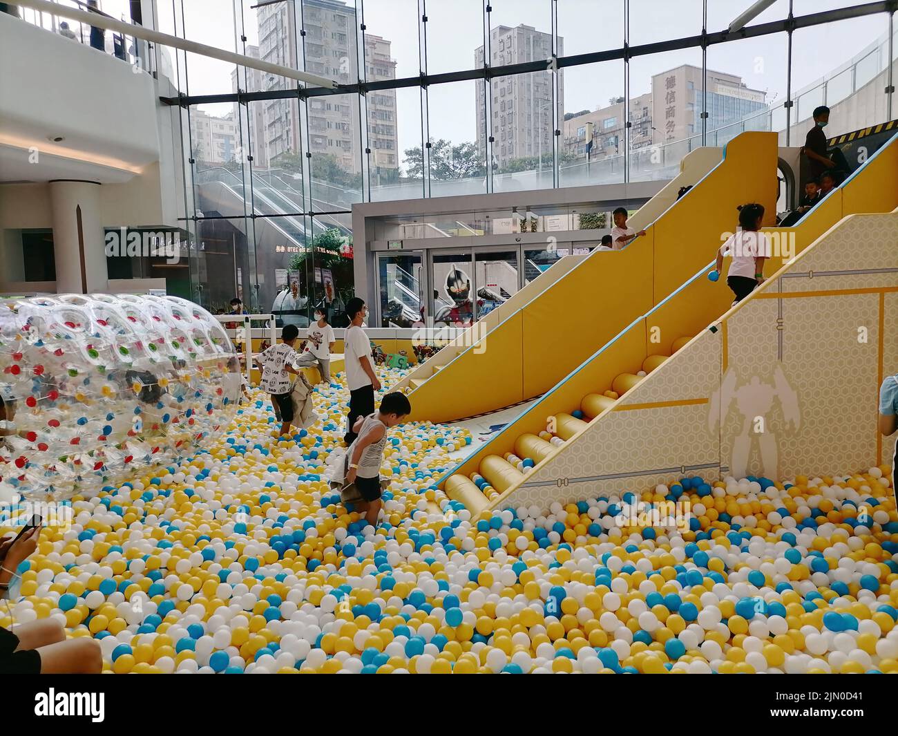 Parents take their children to play in children's playground in ...