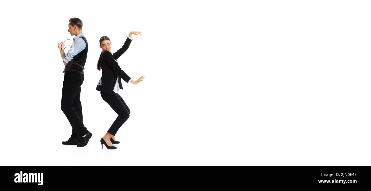 Portrait of man and woman in official clothes posing over white ...