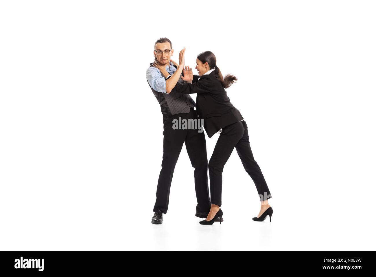 Portrait of man and woman, office managers, employees fighting with ...