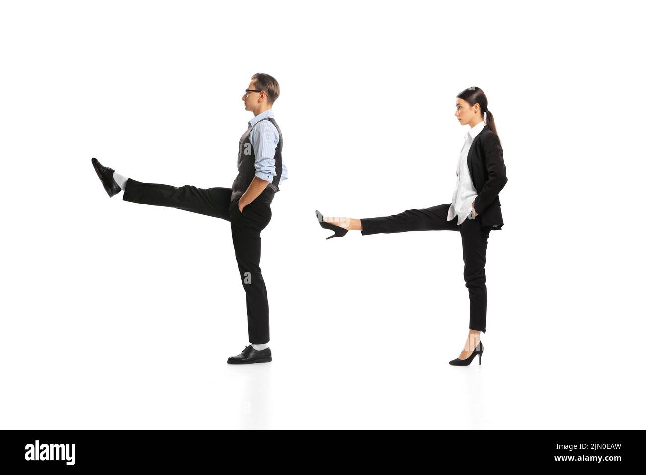 Portrait of two employees, office workers moving forward to success ...