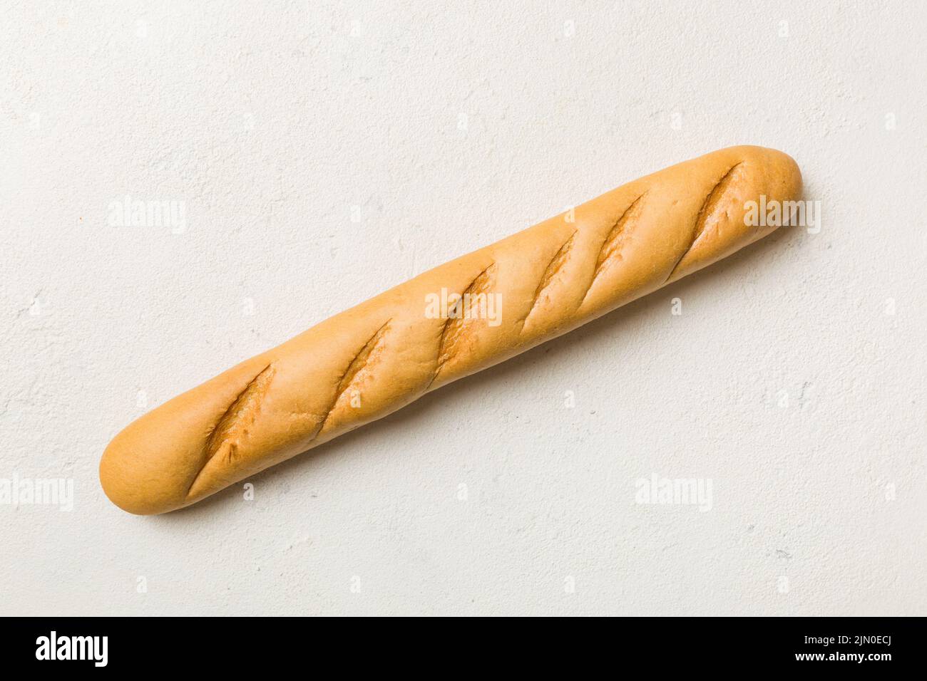 Minimalist french baguette on colored background. fresh bread as ...