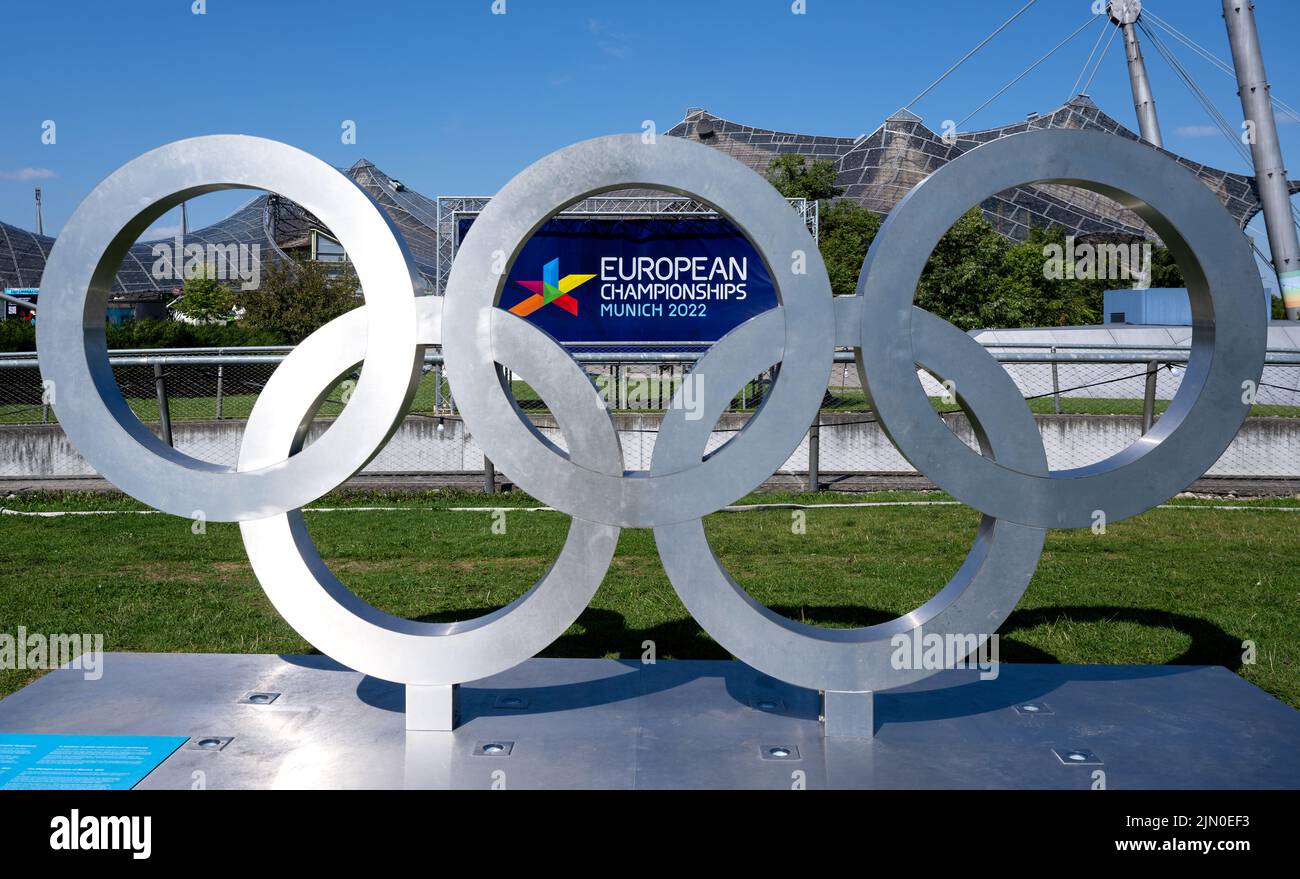 Munich, Germany. 08th Aug, 2022. The Olympic rings and a poster with ...