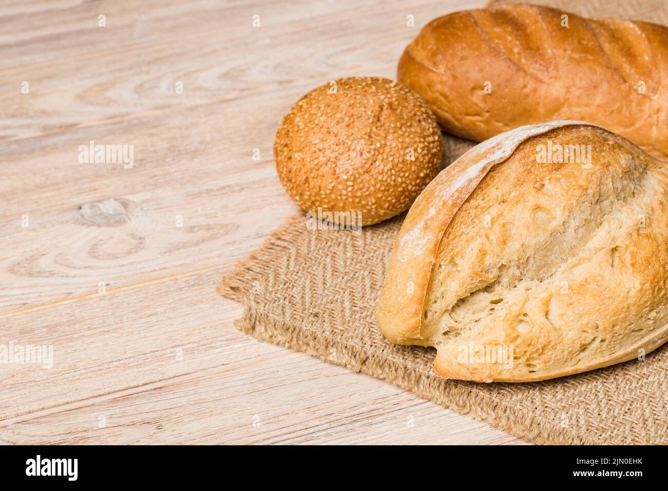 Homemade natural breads. Different kinds of fresh bread as background ...