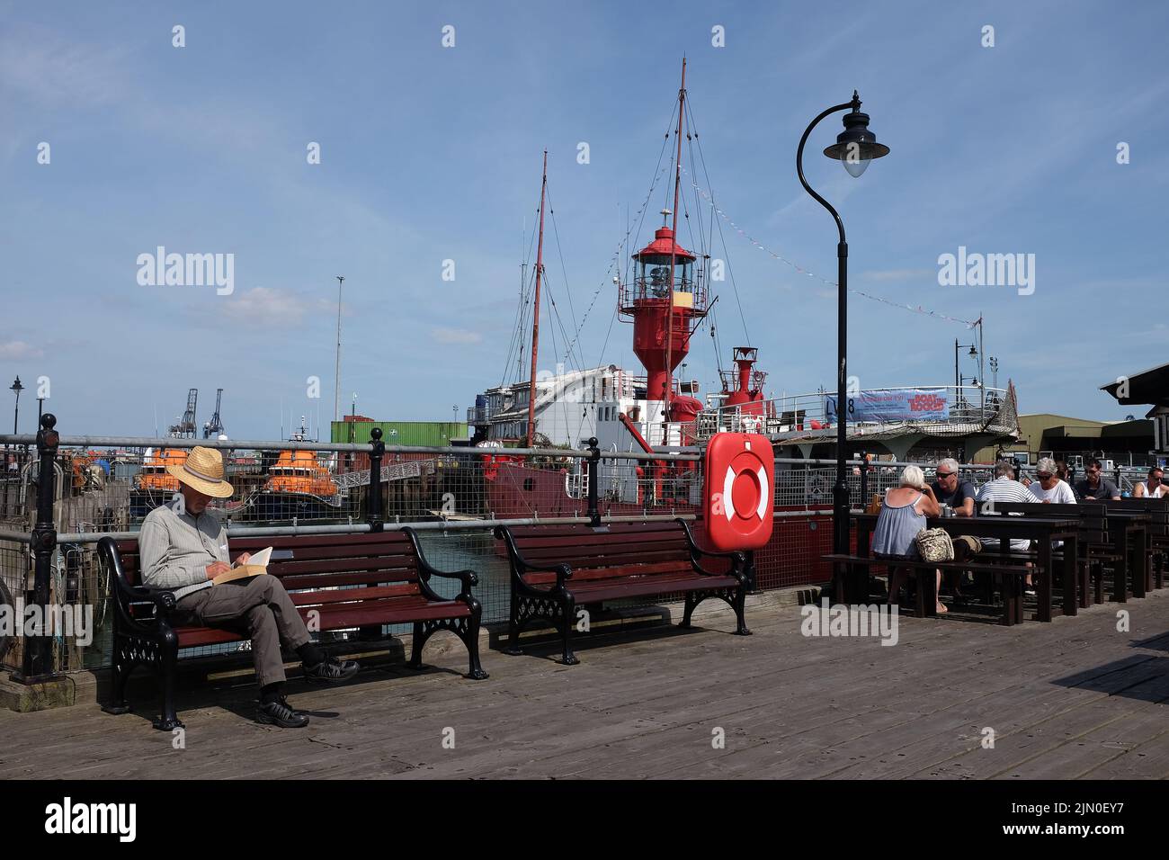 Relaxing on Ha'penny pier Harwich Essex UK Stock Photo - Alamy