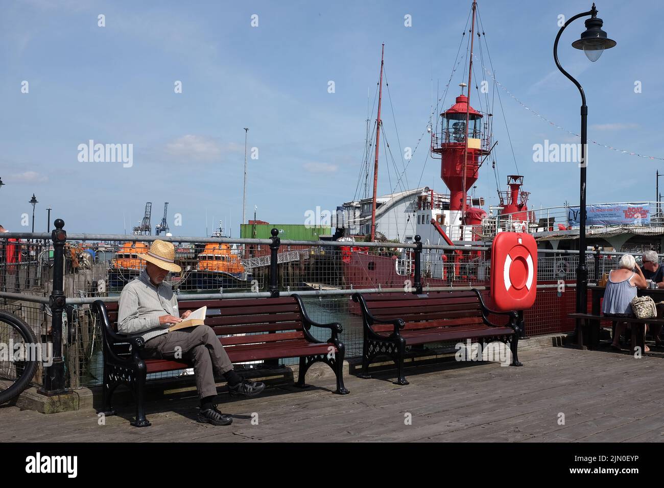 Relaxing on Ha'penny pier Harwich Essex UK Stock Photo - Alamy