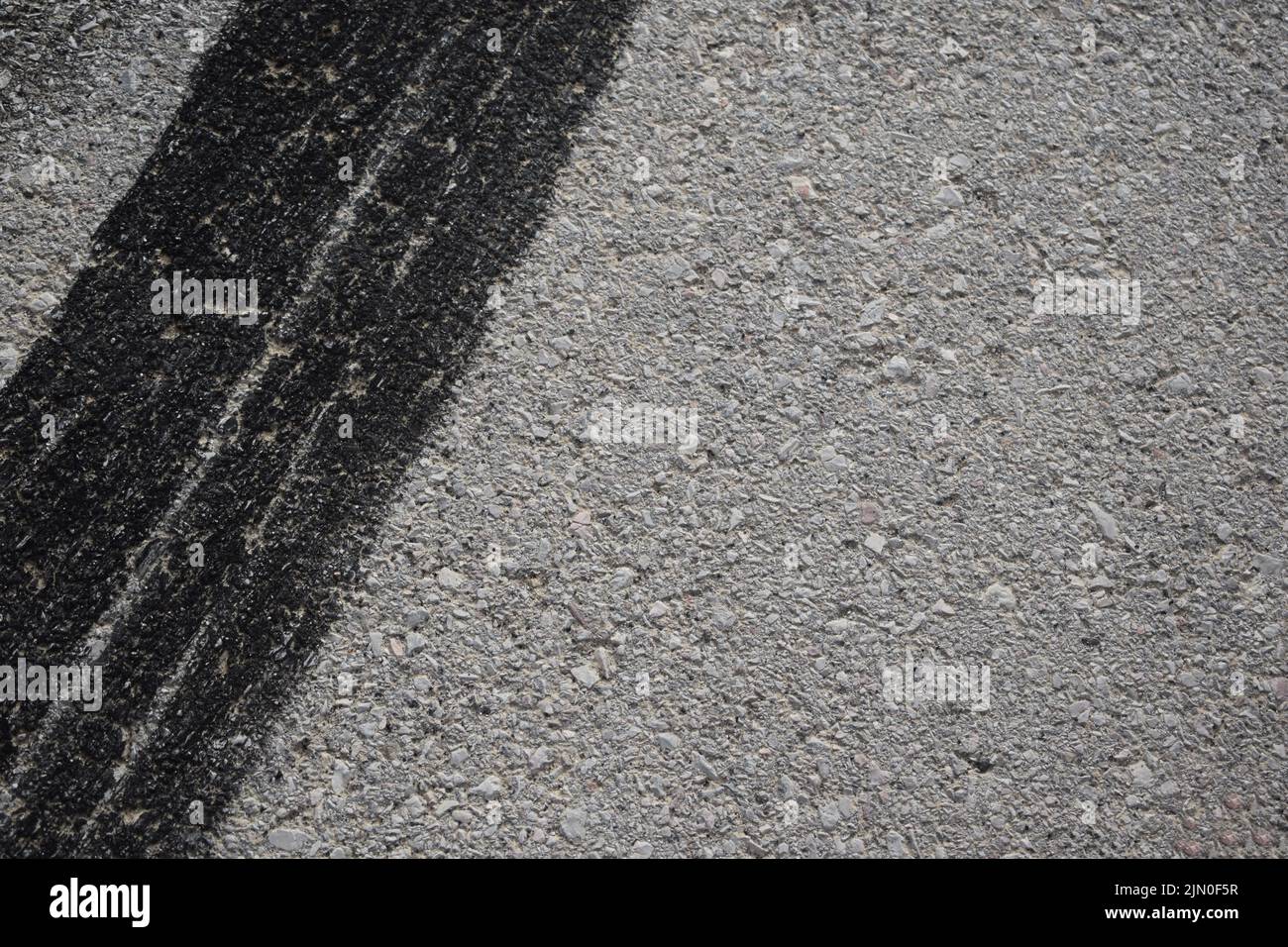 black tire mark on a gray asphalt (texture Stock Photo - Alamy