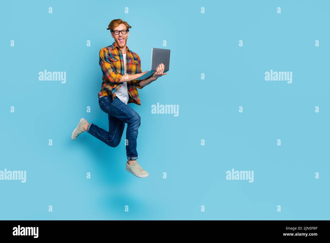 Photo of funky positive guy with ginger hairstyle dressed plaid shirt ...