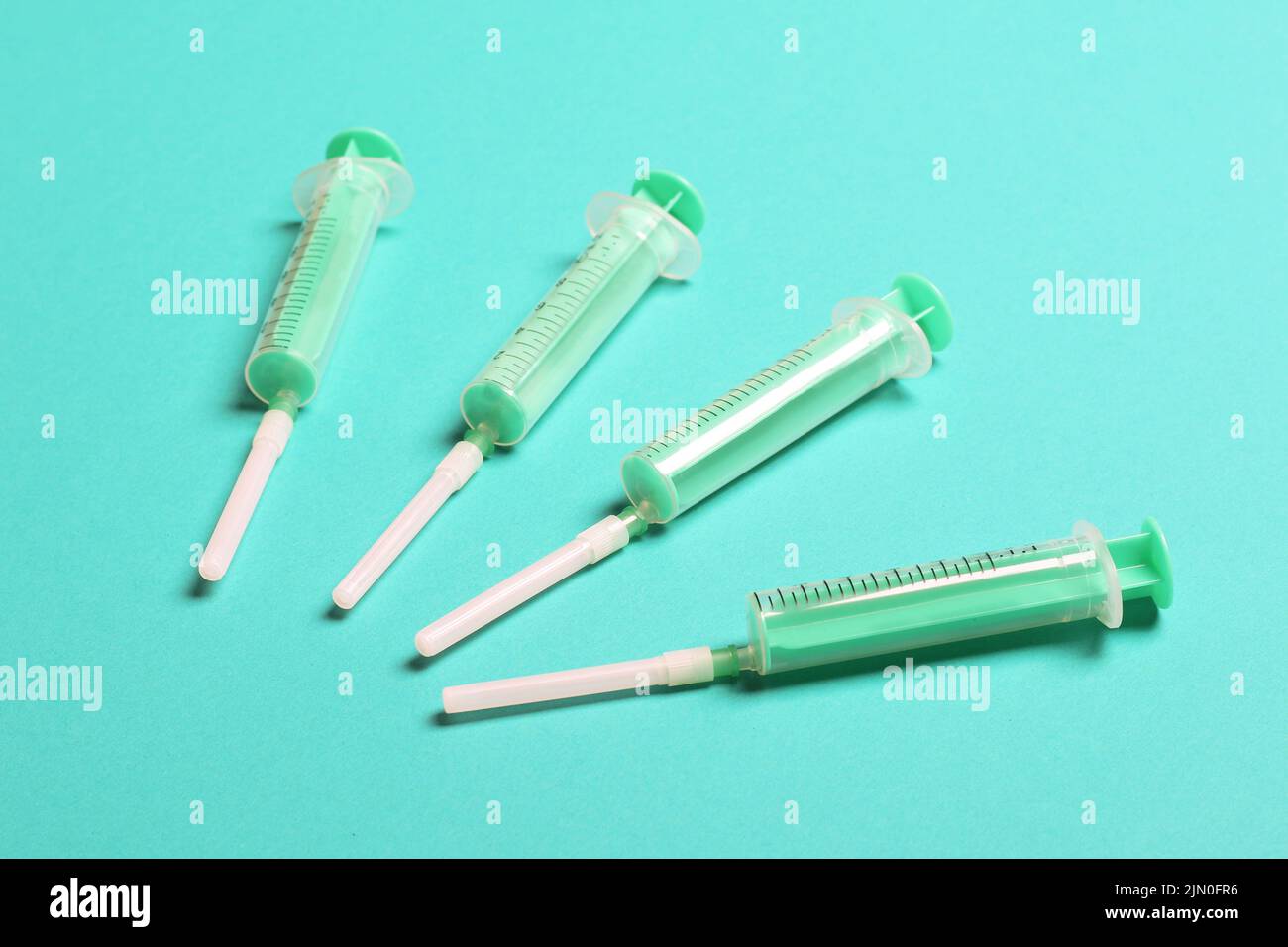 Top view of syringes in a row for medical injection on colorful ...
