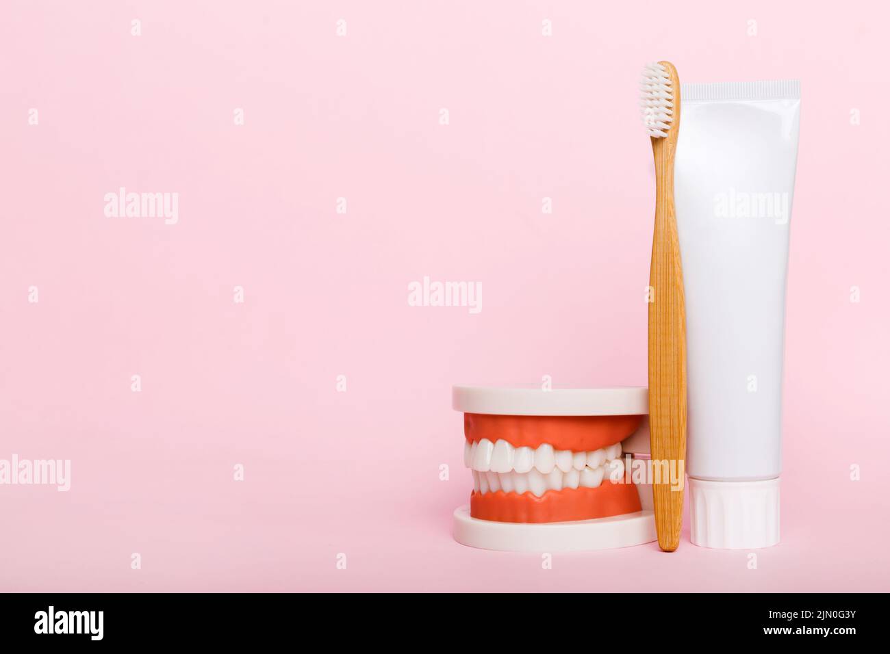 Mouthwash and other oral hygiene products on colored table top view ...