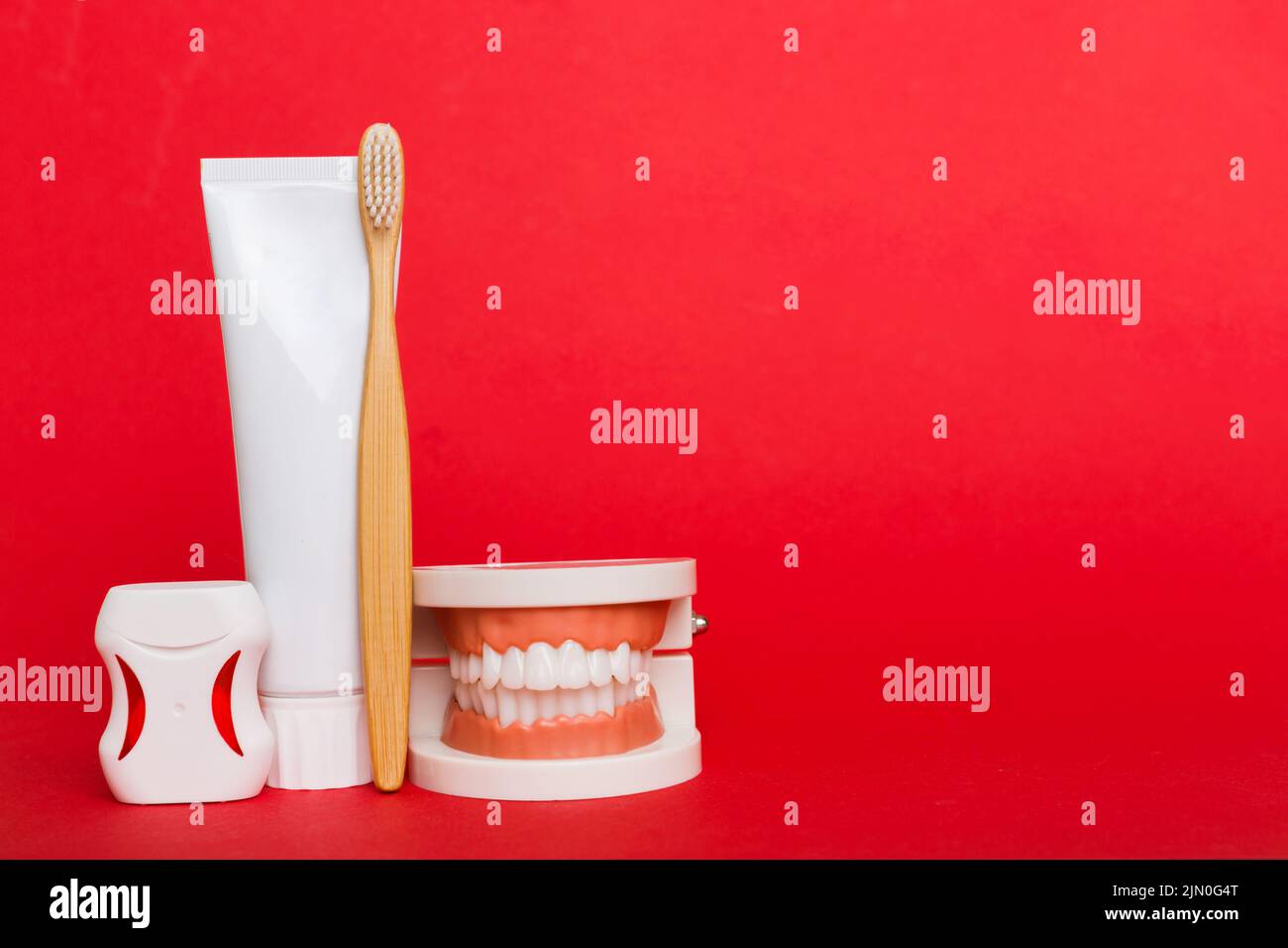 Mouthwash and other oral hygiene products on colored table top view ...