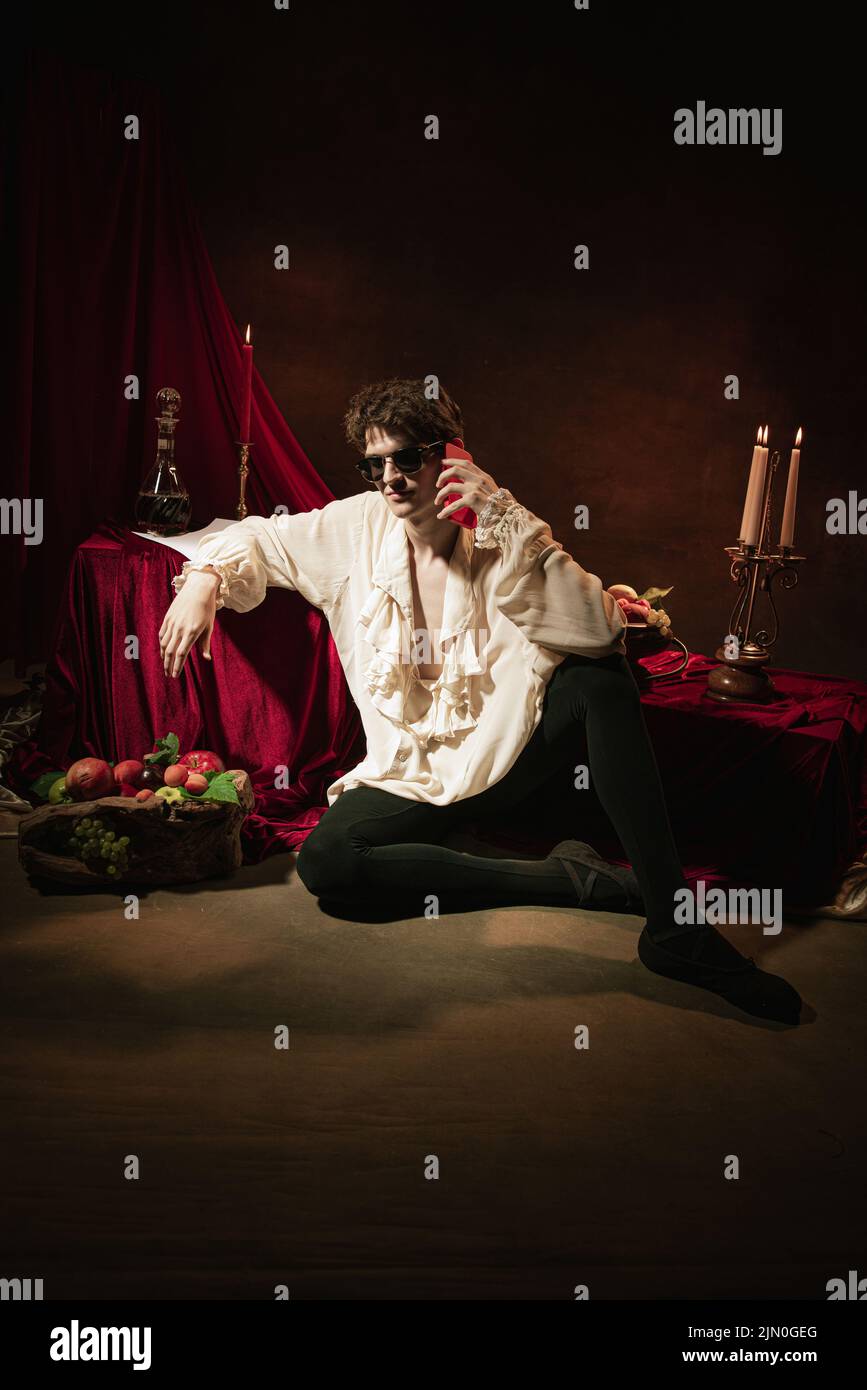 Artistic portrait of young handsome man in image of famous historical ...