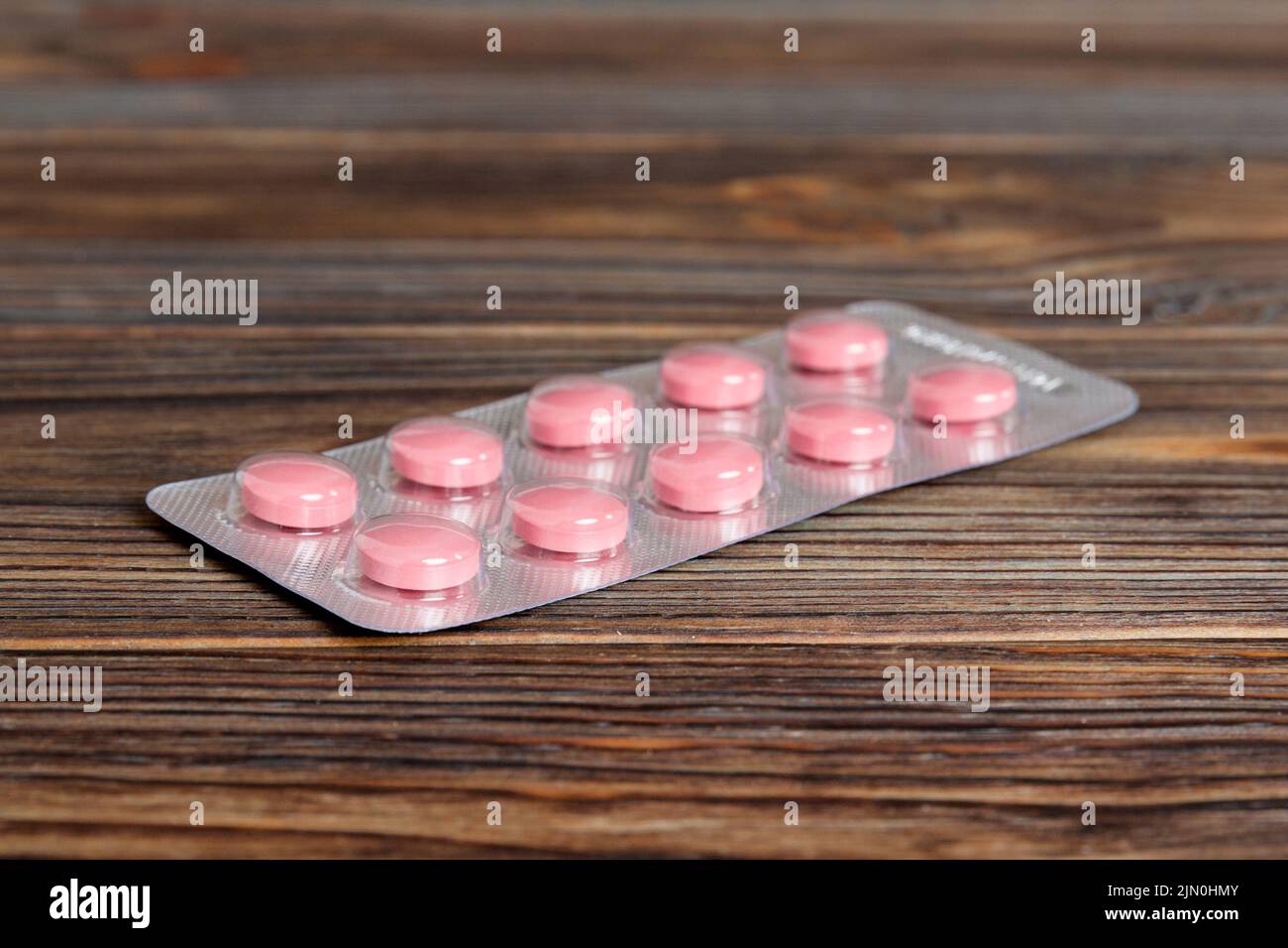 Blister package with Vitamin on color background. Medicine pills on a ...