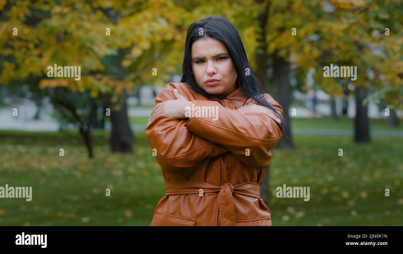 Close-up young hispanic woman standing in autumn park outdoors girl ...