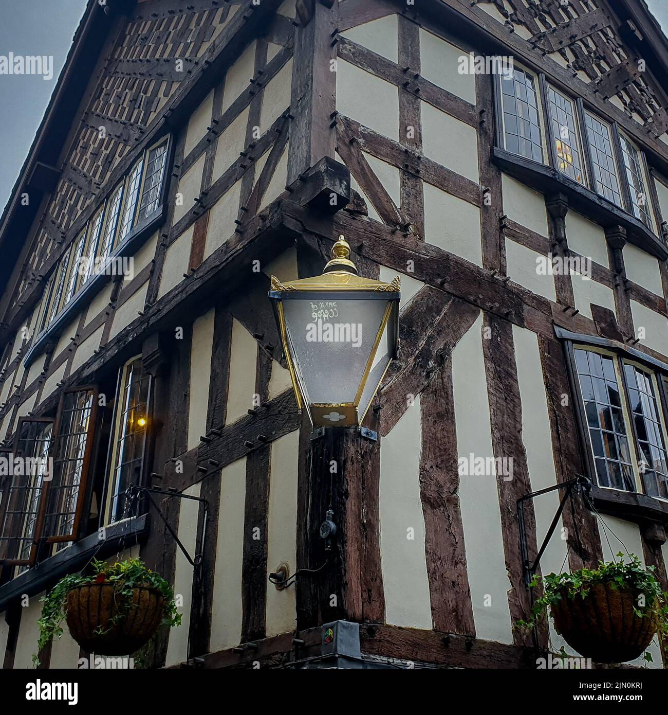 A close-up shot of a vintage street lamp by an old building Stock Photo ...