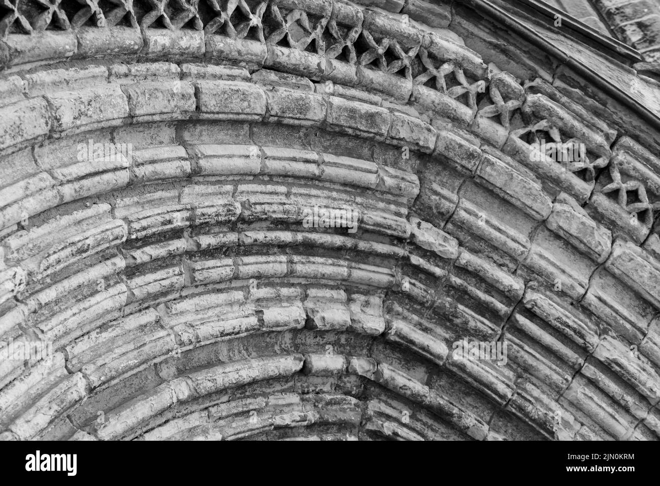 A close-up grayscale shot of arch details of a church Stock Photo - Alamy