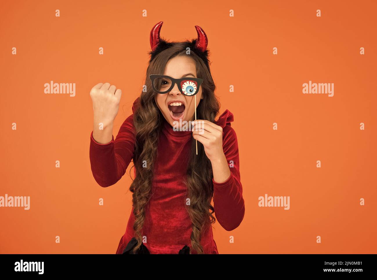 successful trick. childhood leisure. happy halloween. kid wear devil ...