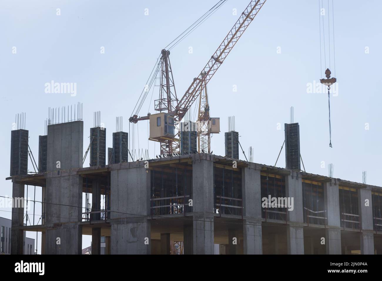 A multi-storey apartment building is being constructed using tower ...