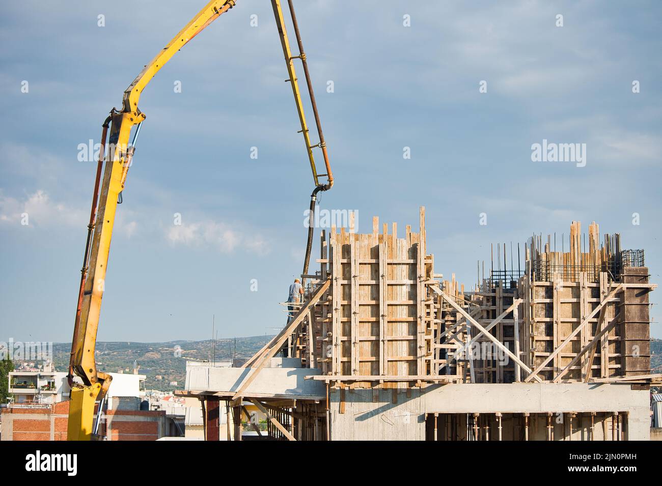 construction site, construction of apartment building with hard working ...