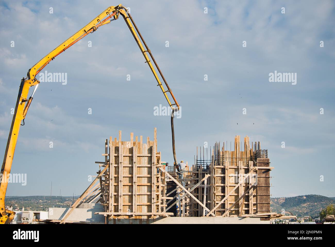 construction site, construction of apartment building with hard working ...