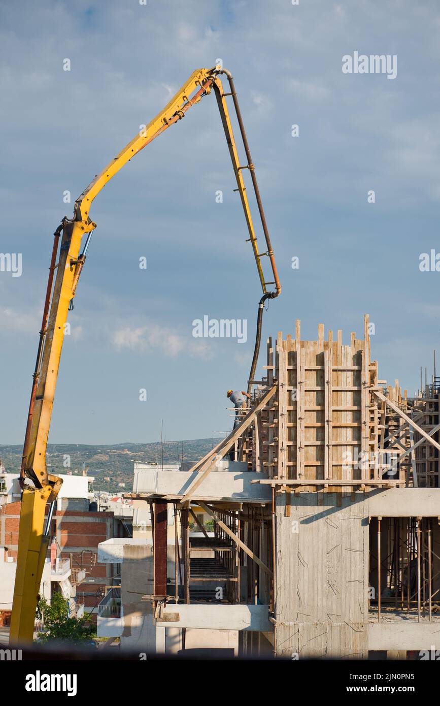 construction site, construction of apartment building with hard working ...