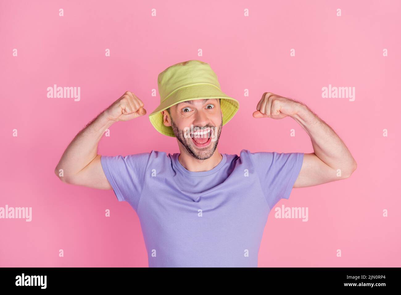 Photo of joyful man show arms muscles training workout exercise regime ...