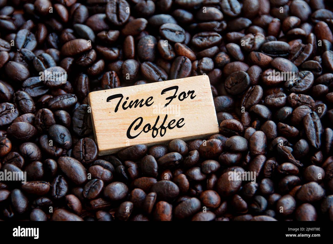 Time for coffee text on wooden blocks with coffee beans background ...