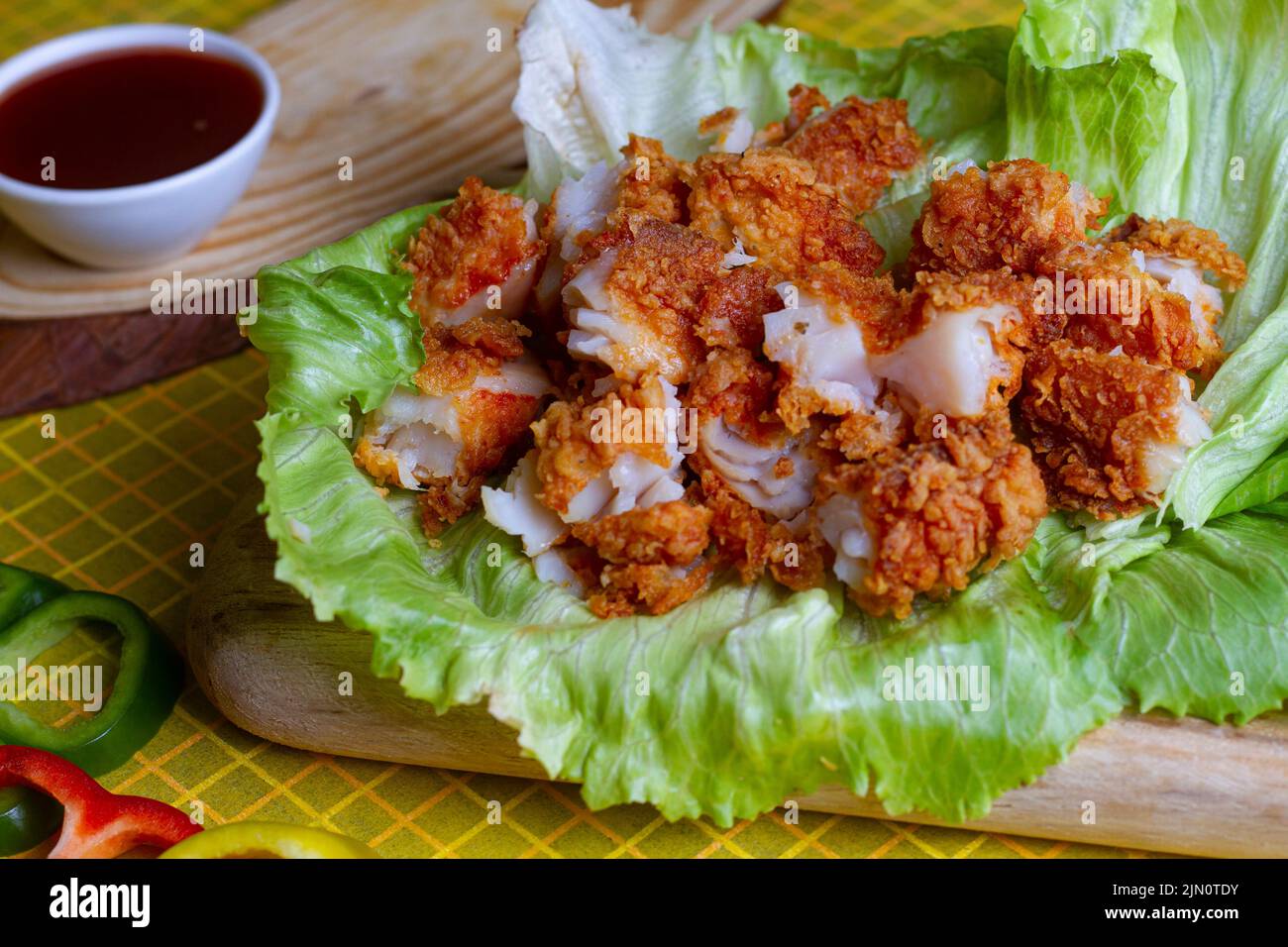 Crispy fish Popcorn with honey mustard sauce on wooden background Stock ...