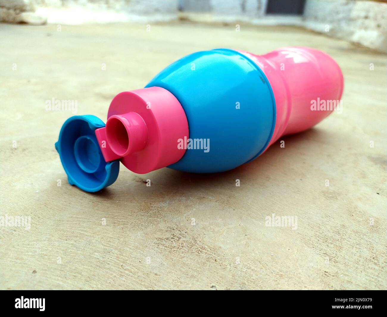 blue and red color bottle put on the road Stock Photo - Alamy