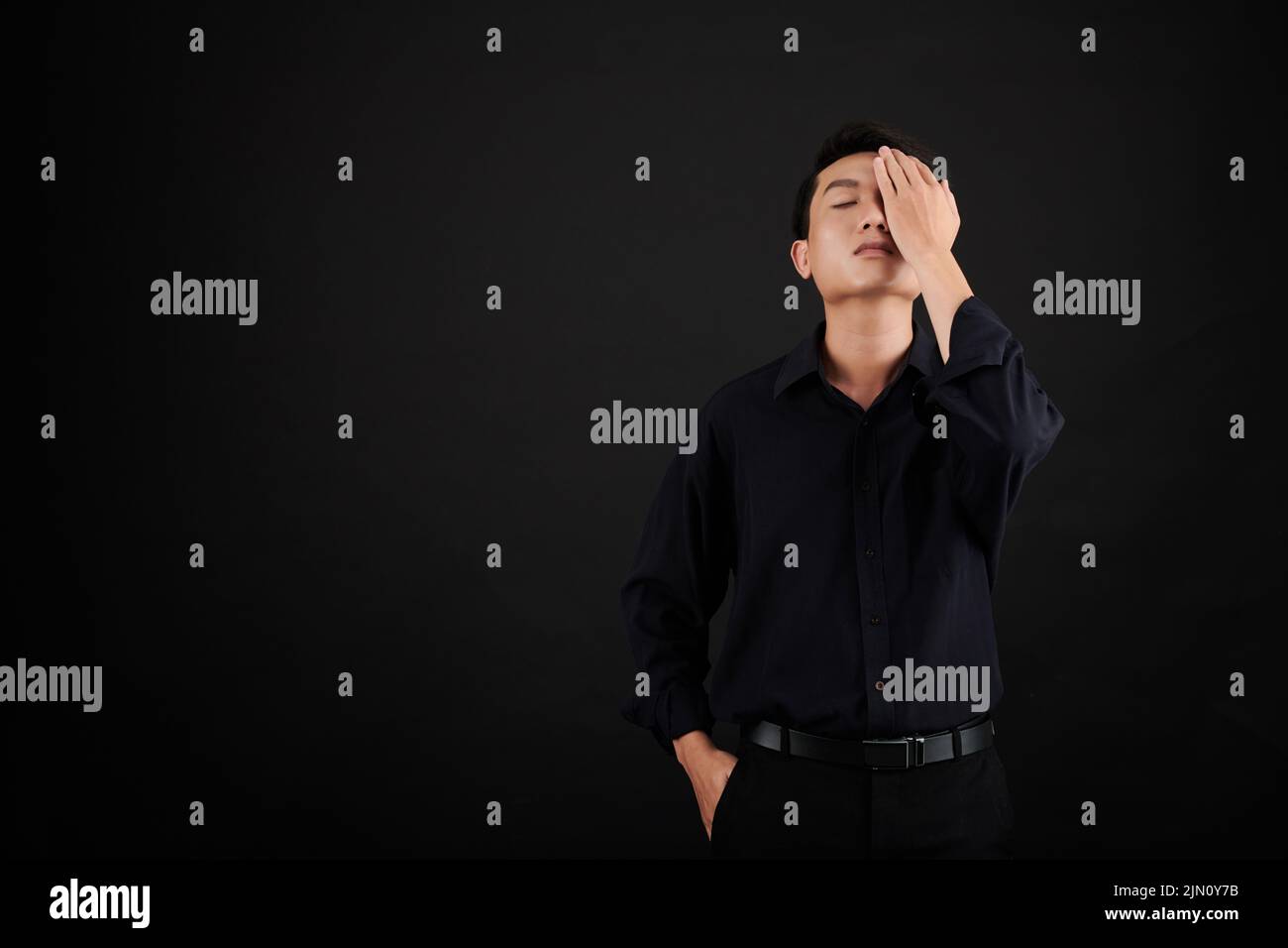 Portrait of embarrassed young man making face palm gesture, isolated on ...