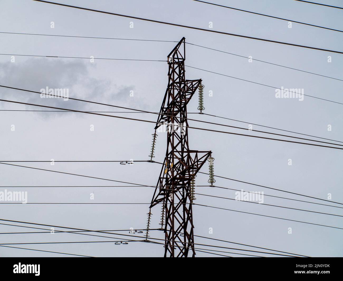 Modern power lines with rusty metallic structure Stock Photo - Alamy